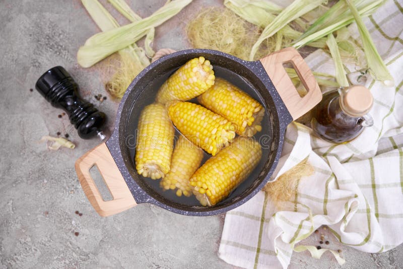 Cooked Corn Cobs in Pot on Grey Concrete Table Stock Image - Image of ...