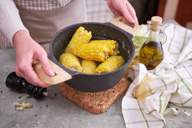 Cooked Corn Cobs in Pot on Grey Concrete Table Stock Image - Image of ...