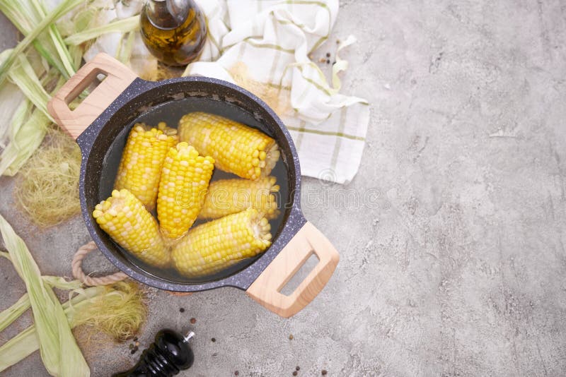 Cooked Corn Cobs in Pot on Grey Concrete Table Stock Image - Image of ...