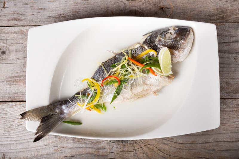Cooked dorado fish stock photo. Image of meal, plate - 74236940
