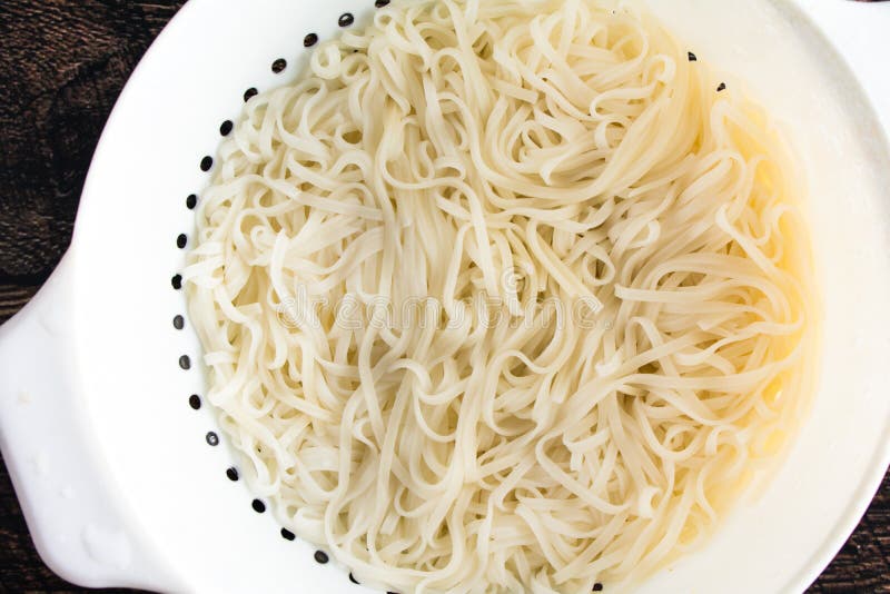 Cooked and Drained Rice Noodles in a White Plastic Colander Stock Photo ...