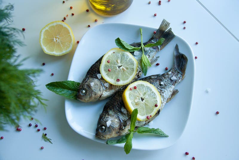 Cooked fish with lemon stock photo. Image of nice, fish - 93117382