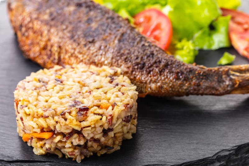 Cooked fish with rice stock image. Image of meat, closeup - 125174547