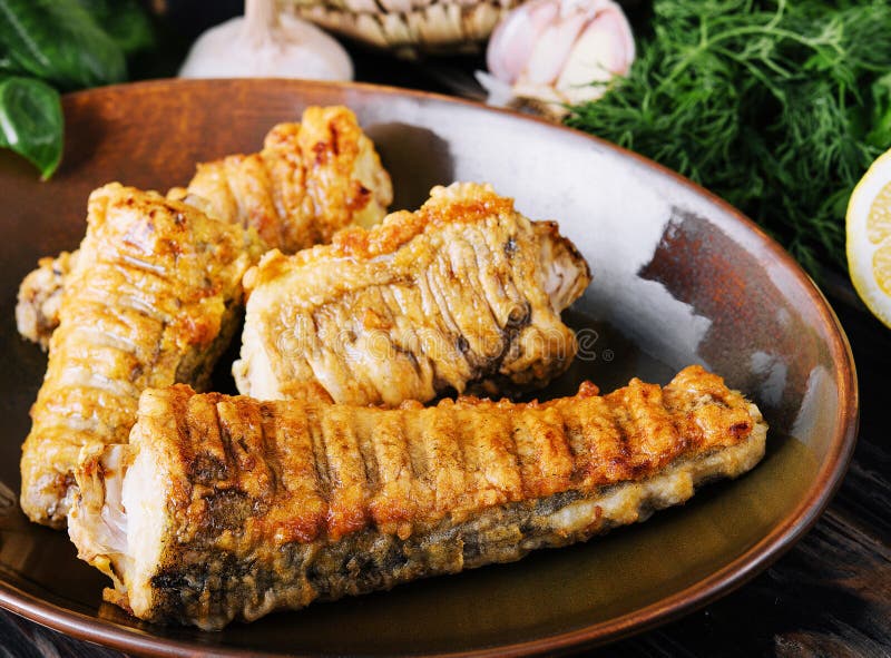 Cooked, Fried Pieces of Fish on a Ceramic Plate Stock Image - Image of ...