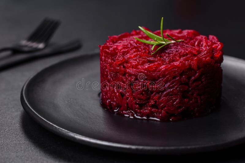 Cooked Grated Beetroot Formed As a Cylinder and Ready Dish on a Black ...