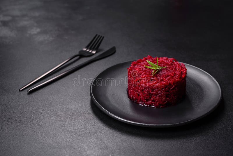 Cooked Grated Beetroot Formed As a Cylinder and Ready Dish on a Black ...