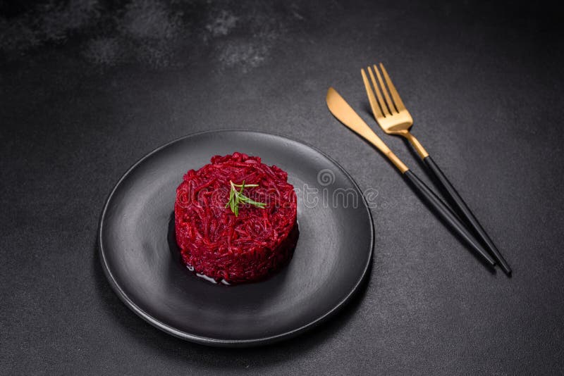 Cooked Grated Beetroot Formed As a Cylinder and Ready Dish on a Black ...