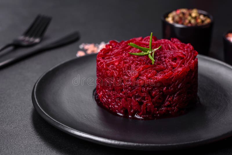 Cooked Grated Beetroot Formed As a Cylinder and Ready Dish on a Black ...