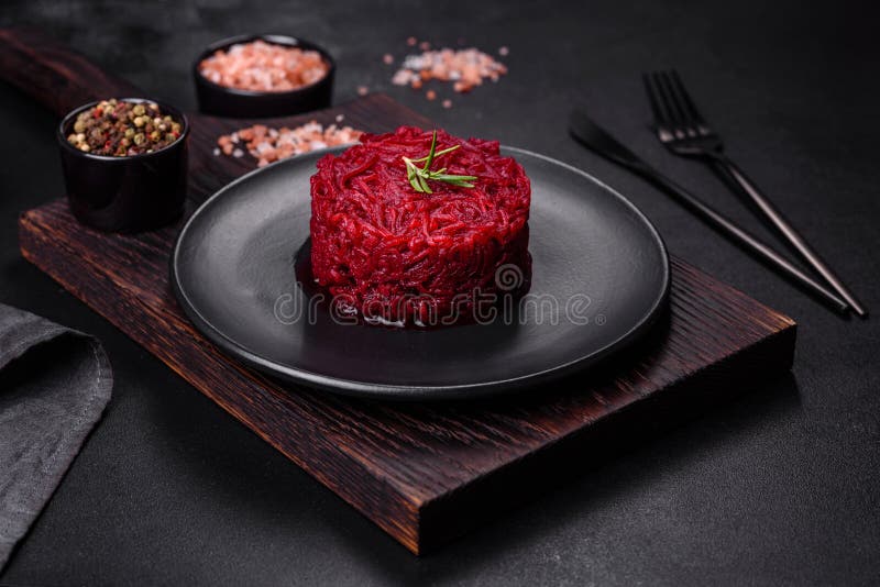 Cooked Grated Beetroot Formed As a Cylinder and Ready Dish on a Black ...