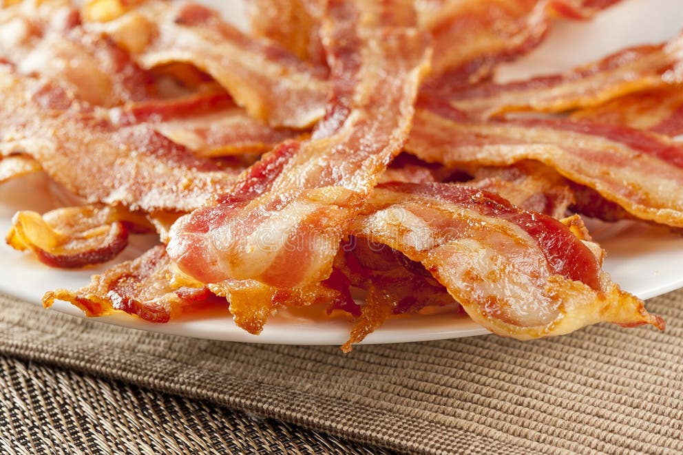 Cooked Greasy Bacon stock photo. Image of tasty, bacon - 318573380