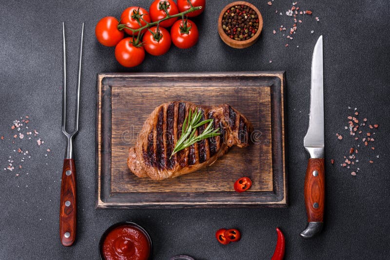 Cooked Grilled Chuck Eye Roll Steak on a Chopping Board Stock Image ...