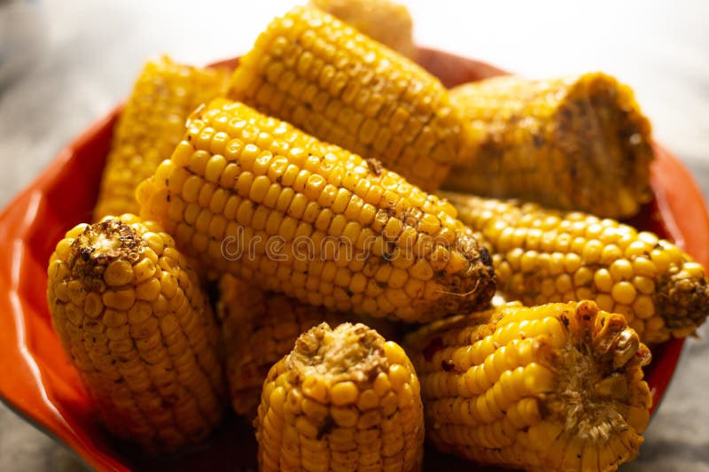 Cooked hot corn on a plate stock photo. Image of agriculture - 344755804