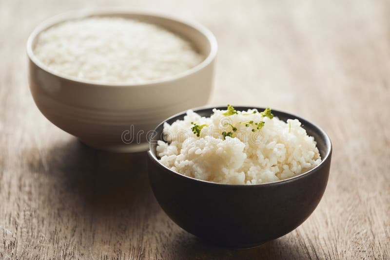 Cooked Jasmine Rice and Raw Organic Rice Stock Image - Image of ...