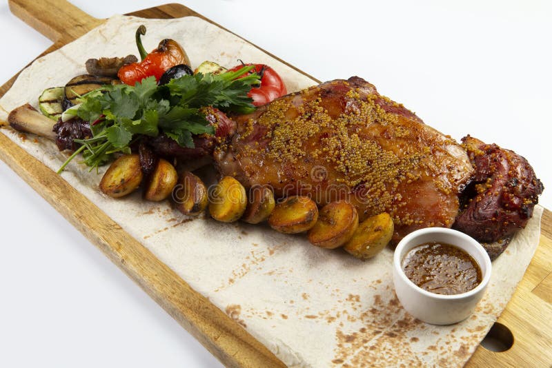 Cooked Leg of Lamb on a Wooden Board. Stock Image - Image of bone ...