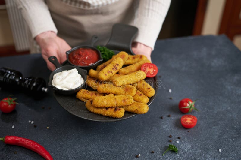 Cooked Mozzarella Cheese Sticks with Tartar and Red Tomato Sauces on a ...