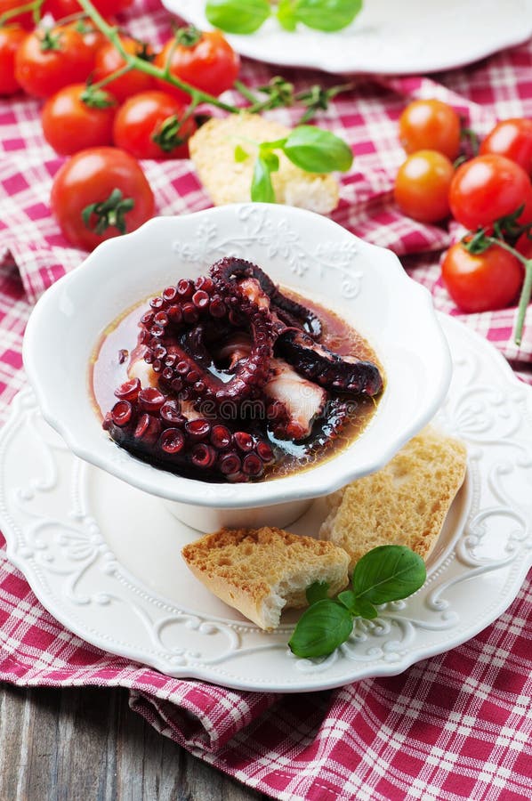 Cooked octopus with bread stock photo. Image of meal - 61389212