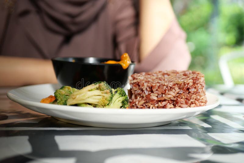 Cooked Red Rice and Vegetables on a Plate Stock Photo - Image of ...