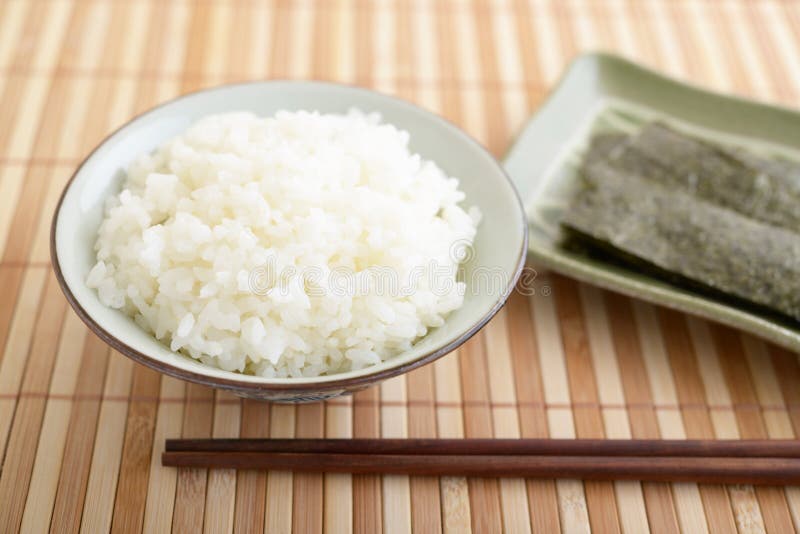 Cooked rice in bowl stock photo. Image of grain, delicious - 129784866