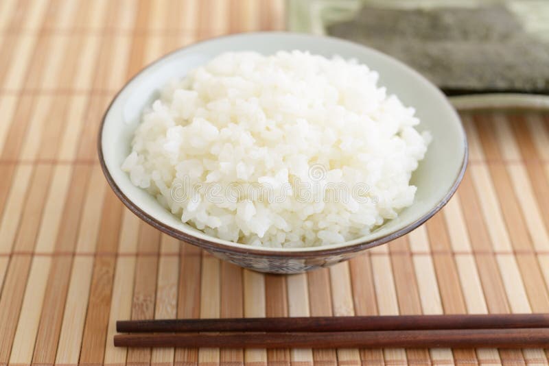 Cooked rice in bowl stock image. Image of harvesting - 129784805