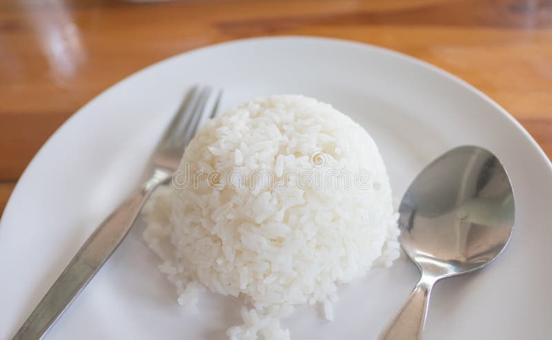 Cooked Rice Fork and Spoon in White Dish Stock Image - Image of ...