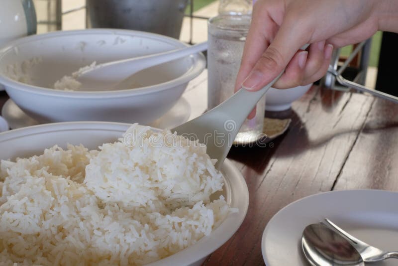 Cooked Rice in Ladle Hand Held Scoop from Pot Stock Photo - Image of ...