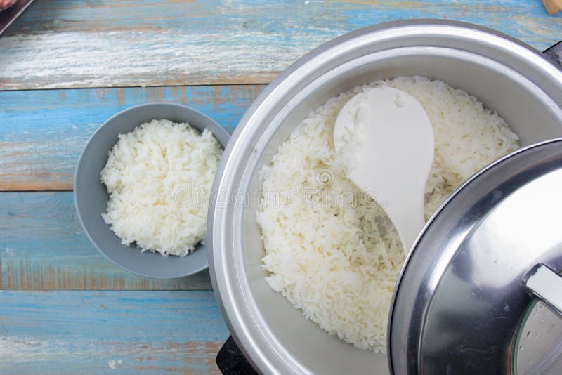 Cooked Rice on Plastic Ladle in Electric Rice Cooker Stock Photo ...