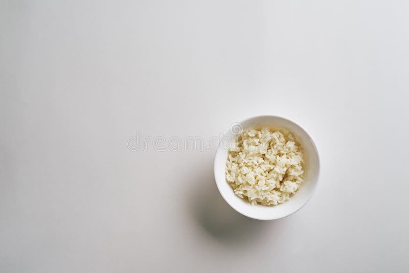 Cooked Rice in Plate Isolated on White Background. Top View Stock Photo ...