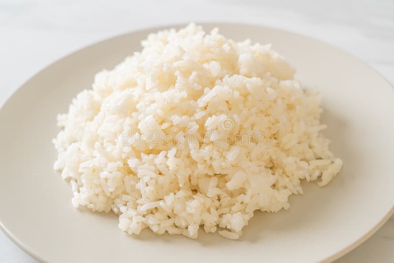 Cooked rice on plate stock photo. Image of plate, carbohydrate - 194285076