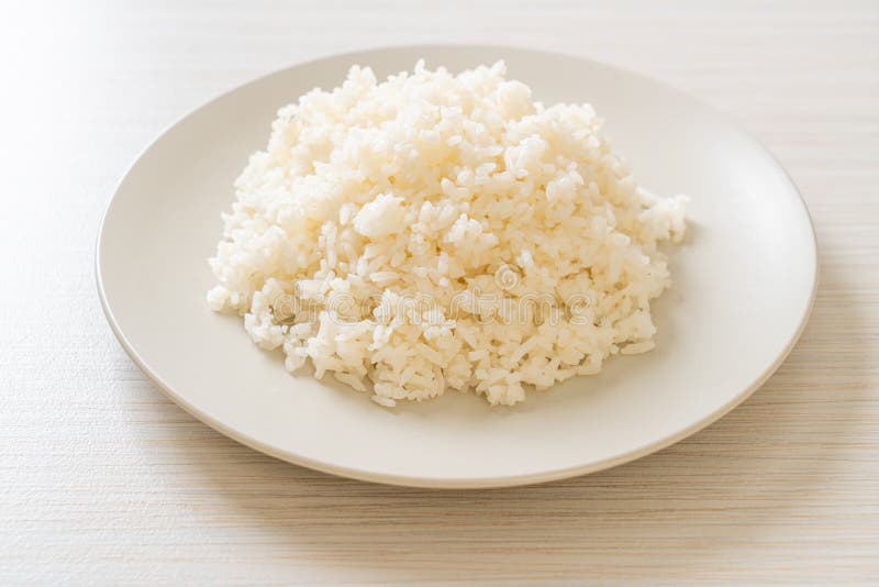 Cooked rice on plate stock photo. Image of healthy, full - 209855418