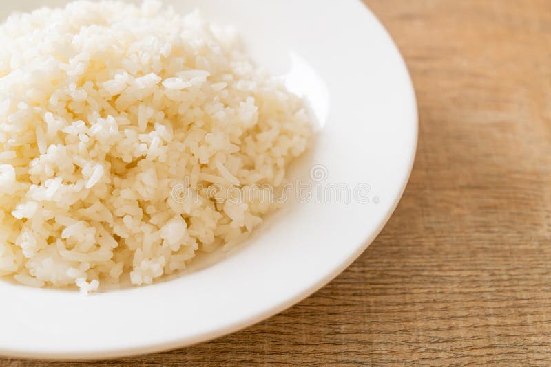 Cooked rice on plate stock photo. Image of background - 242974898