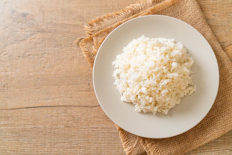 Cooked rice on plate stock photo. Image of background - 242974898