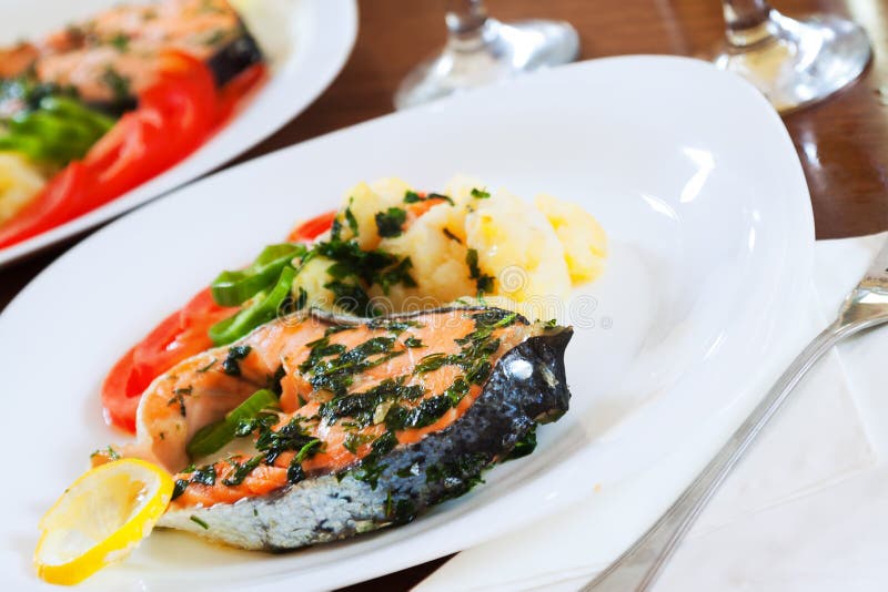 Cooked Fish On The Plate Over White Stock Photo - Image of closeup ...