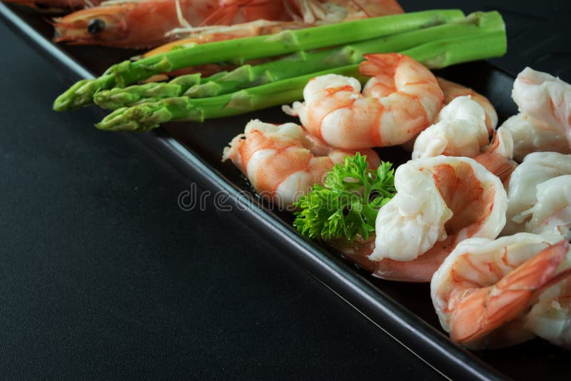 Cooked Shrimps or Prawns Isolated on a Dark Background. Seafood Stock ...