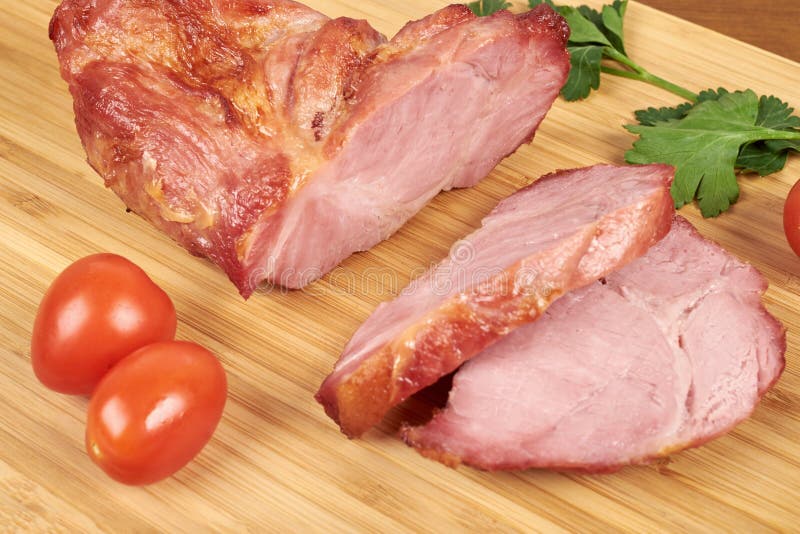 Cooked Sliced Pork Ham Steak on Wooden Cutting Board. Stock Photo ...