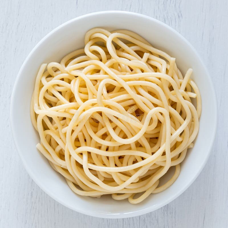 Cooked Spaghetti in a White Ceramic Bowl Isolated on White Painted Wood ...