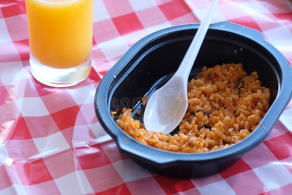 Cooked Spicy Rice in a Packet with Orange Juice on Table Stock Photo ...