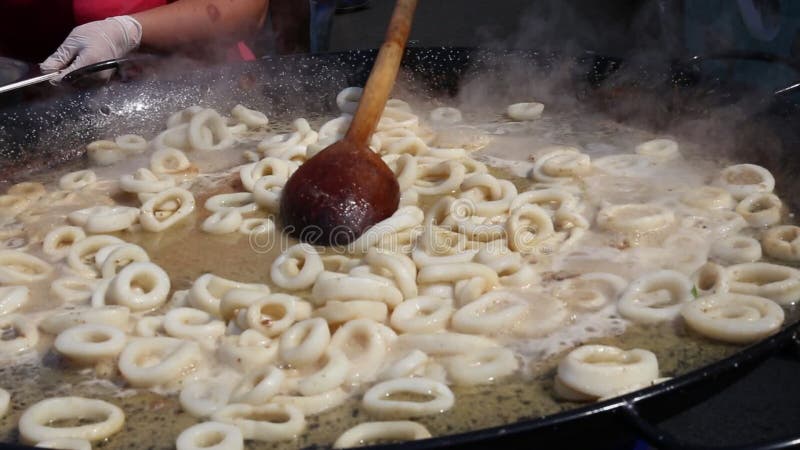 Cooked squid rings stock video. Video of octopus, shellfish - 77044555