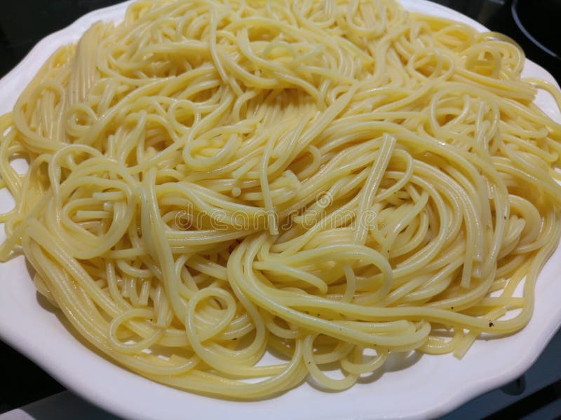 Cooked Stringy Spaghetti on a Plate Stock Photo - Image of plate, long ...