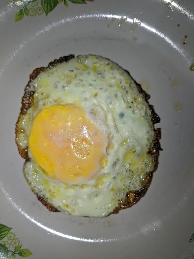 Cooked Sunny Side Up Egg on a Plate Stock Image - Image of cooked ...