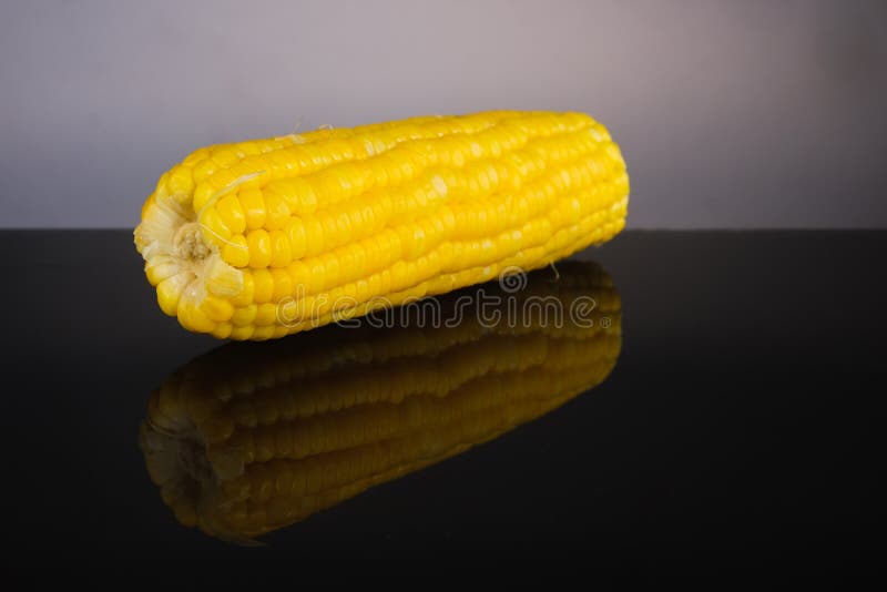 Cooked Sweet Corn with Reflection on Glass Table Stock Photo - Image of ...