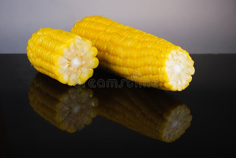 Cooked Sweet Corn with Reflection on Glass Table Stock Image - Image of ...