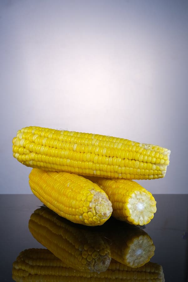 Cooked Sweet Corn with Reflection on Glass Table Stock Photo - Image of ...