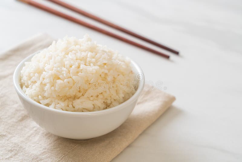 Cooked white rice bowl stock photo. Image of diet, grain - 220460370