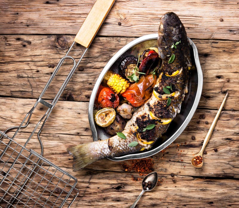 Grilled fish in a tray stock photo. Image of dinner - 100888022