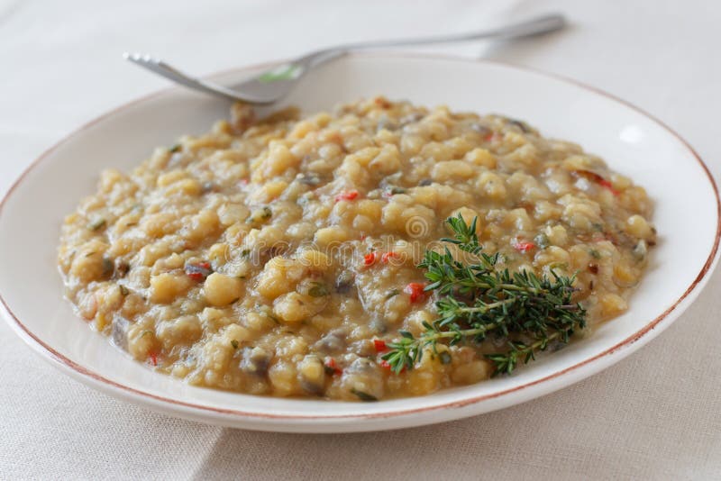 Cooked Red Yellow Fried Sweet Peppers and a Garlic on a White Plate ...
