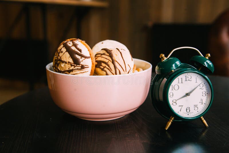 Cookie and Clock on the Table Stock Image - Image of work, room: 63785373