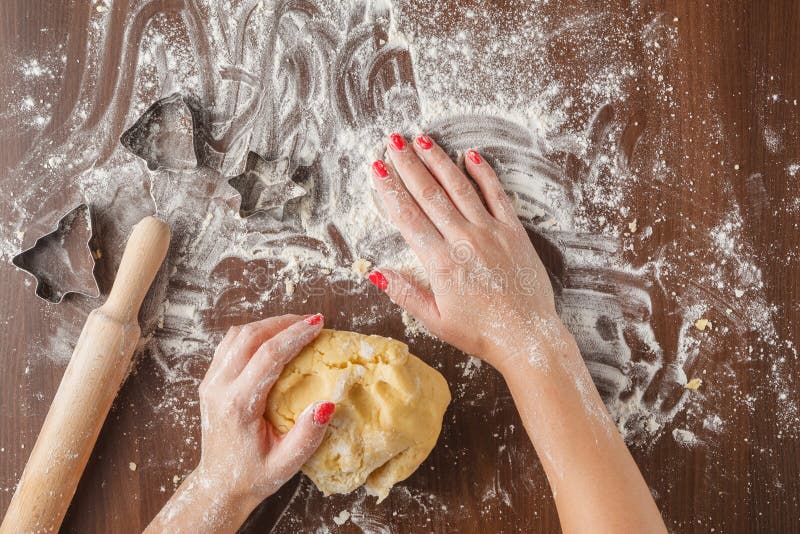 Cookie Cutters and Shortbread Shapes on a Board and a Baking Tray Stock ...