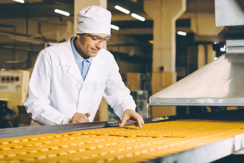 Cookie factory making stock image. Image of biscuit - 132044911
