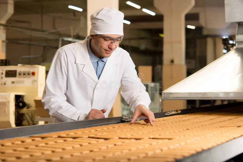 Cookie factory making stock image. Image of worker, product - 131948847