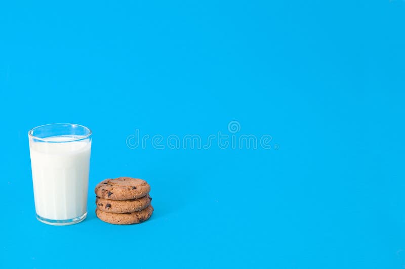 Cookies and Glass of Milk on Blue Background. Oatmeal Cookie with ...